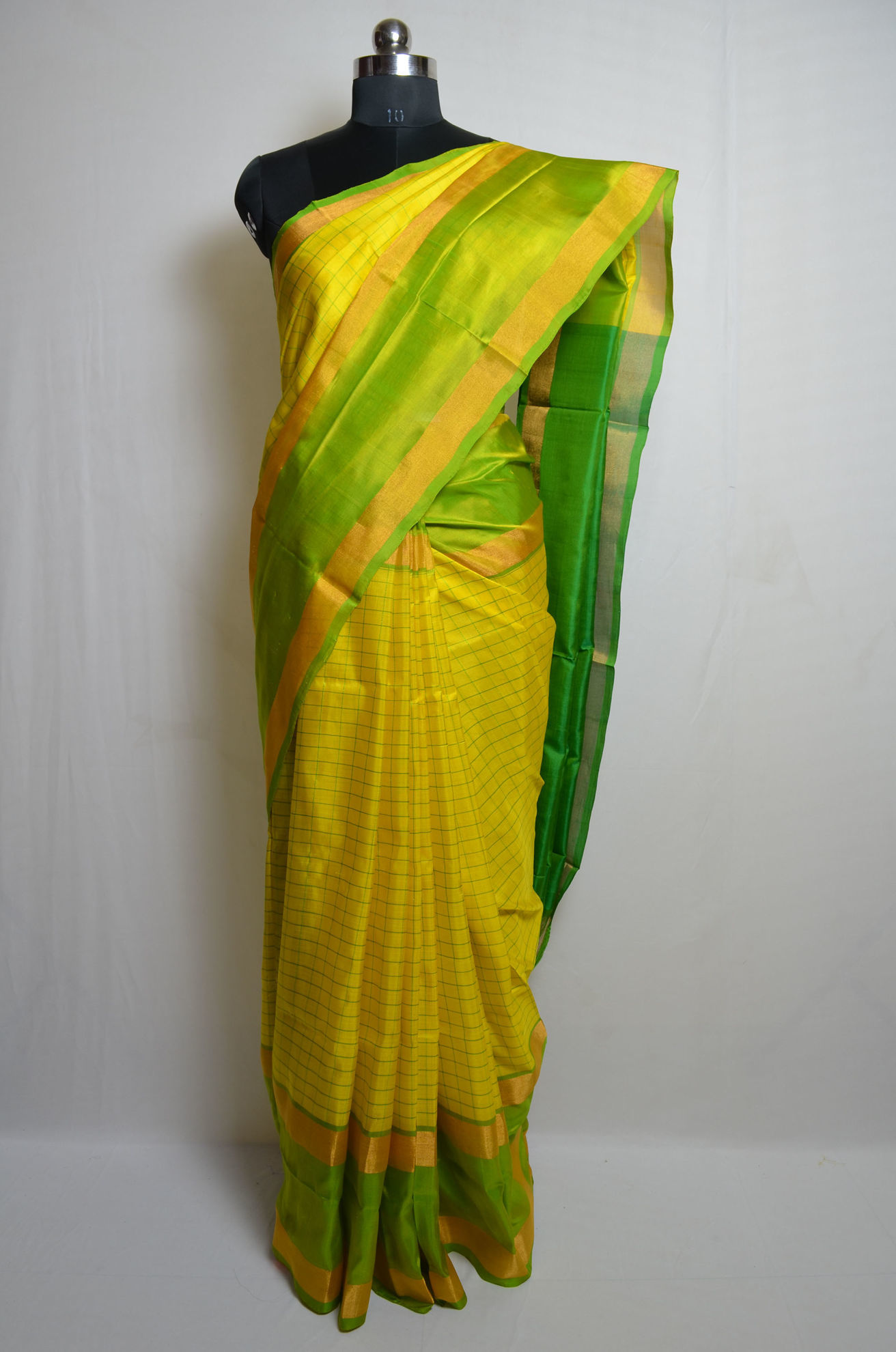 Tvis and Bliss. Yellow and Green Checks Uppada Silk Saree