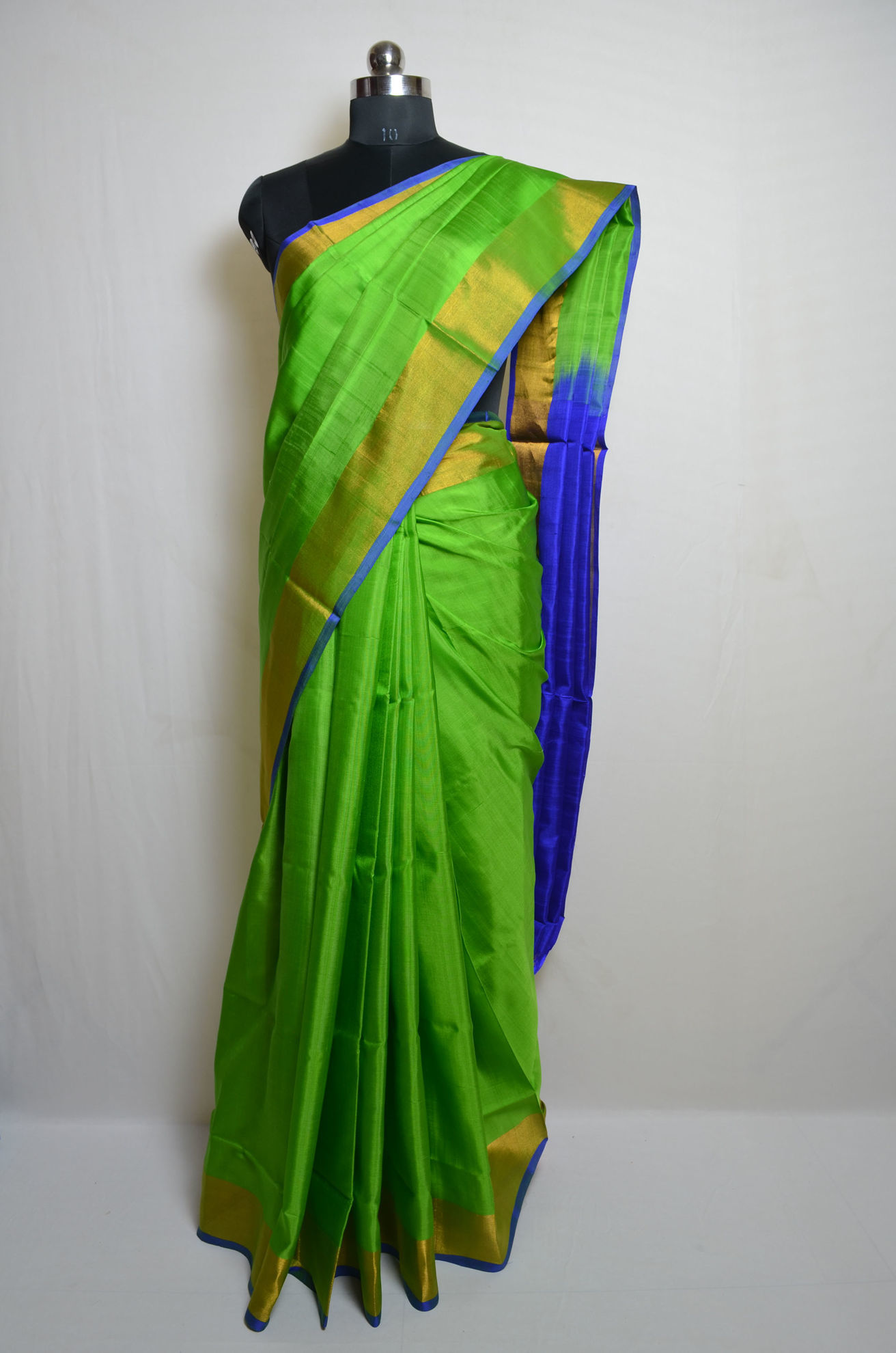 Tvis and Bliss. Parrot Green and Royal Blue Uppada Silk Saree
