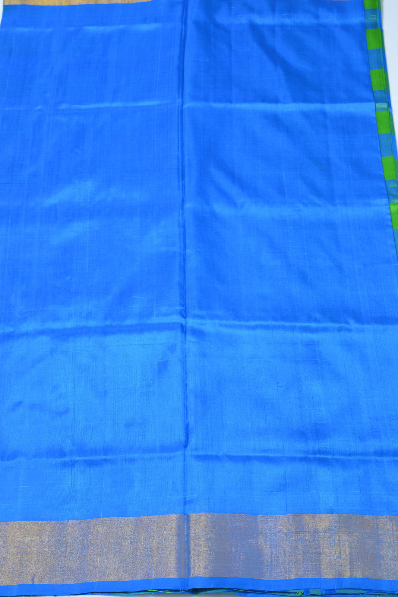 Tvis and Bliss. Anand Blue and Parrot Green Checks Uppada Silk Saree