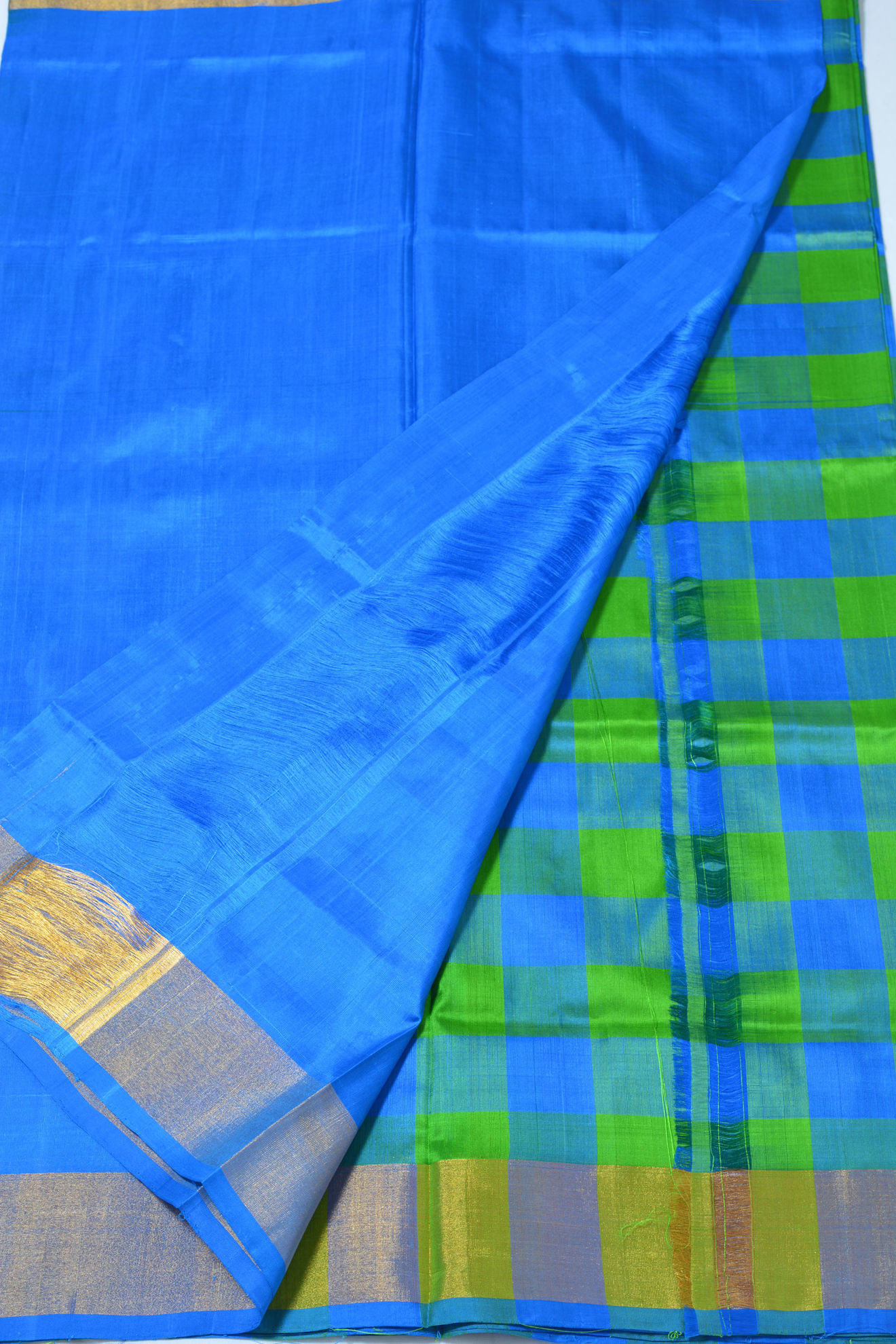 Tvis and Bliss. Anand Blue and Parrot Green Checks Uppada Silk Saree