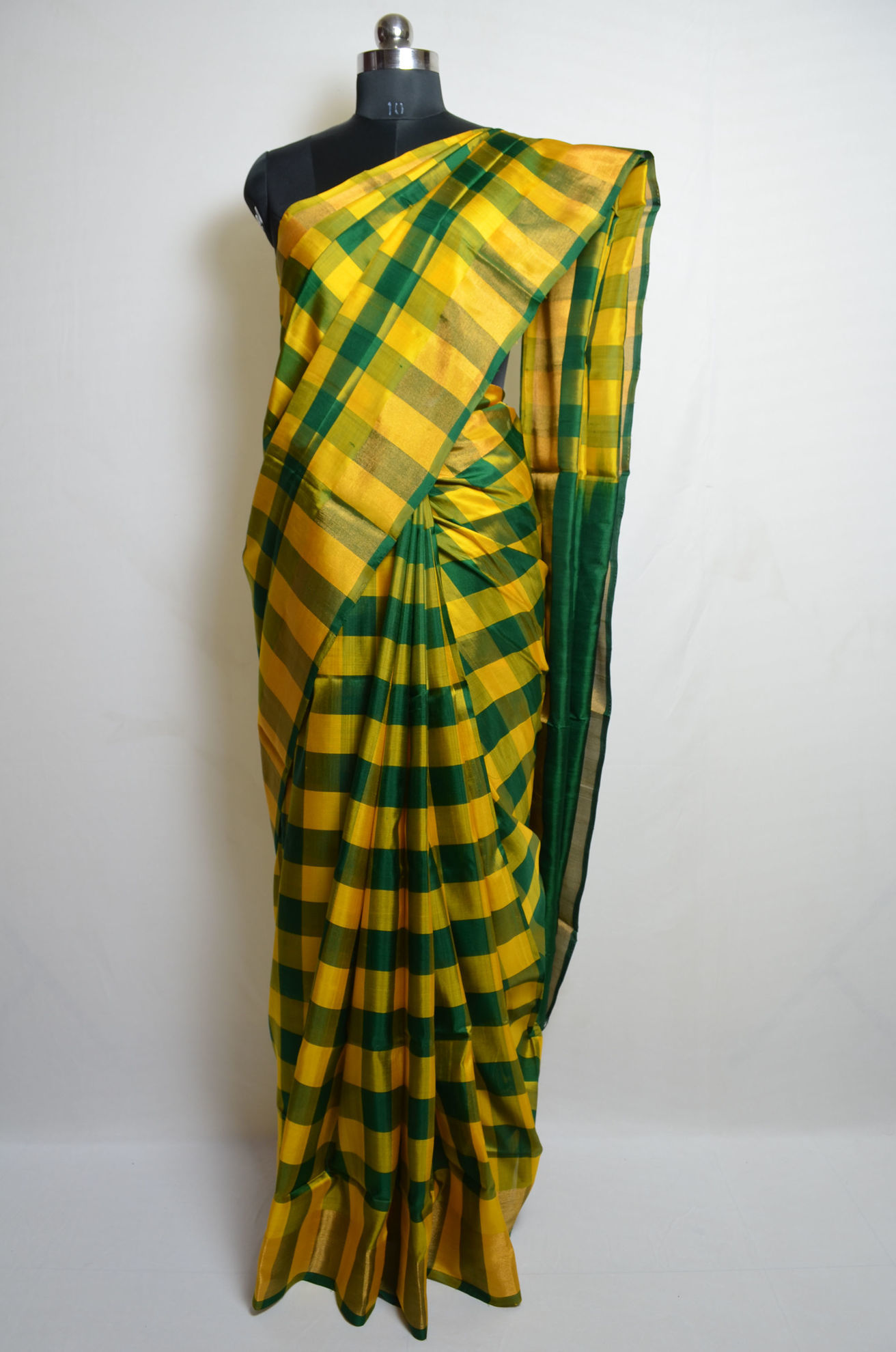 Tvis and Bliss. Dark Green and Yellow Checks Uppada Silk Saree