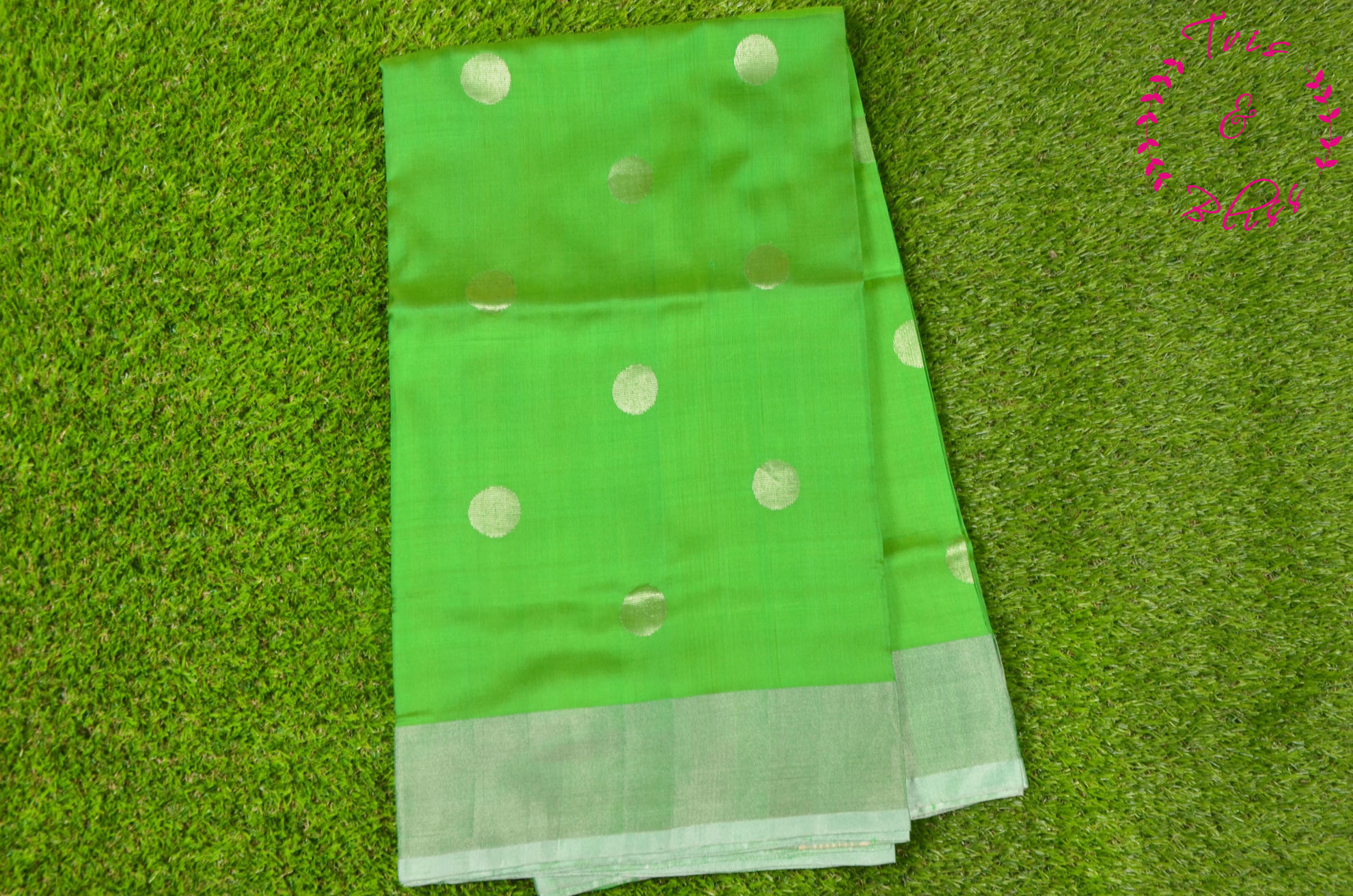 Tvis and Bliss. Parrot Green Uppada Silk Saree with Silver Butta and Border