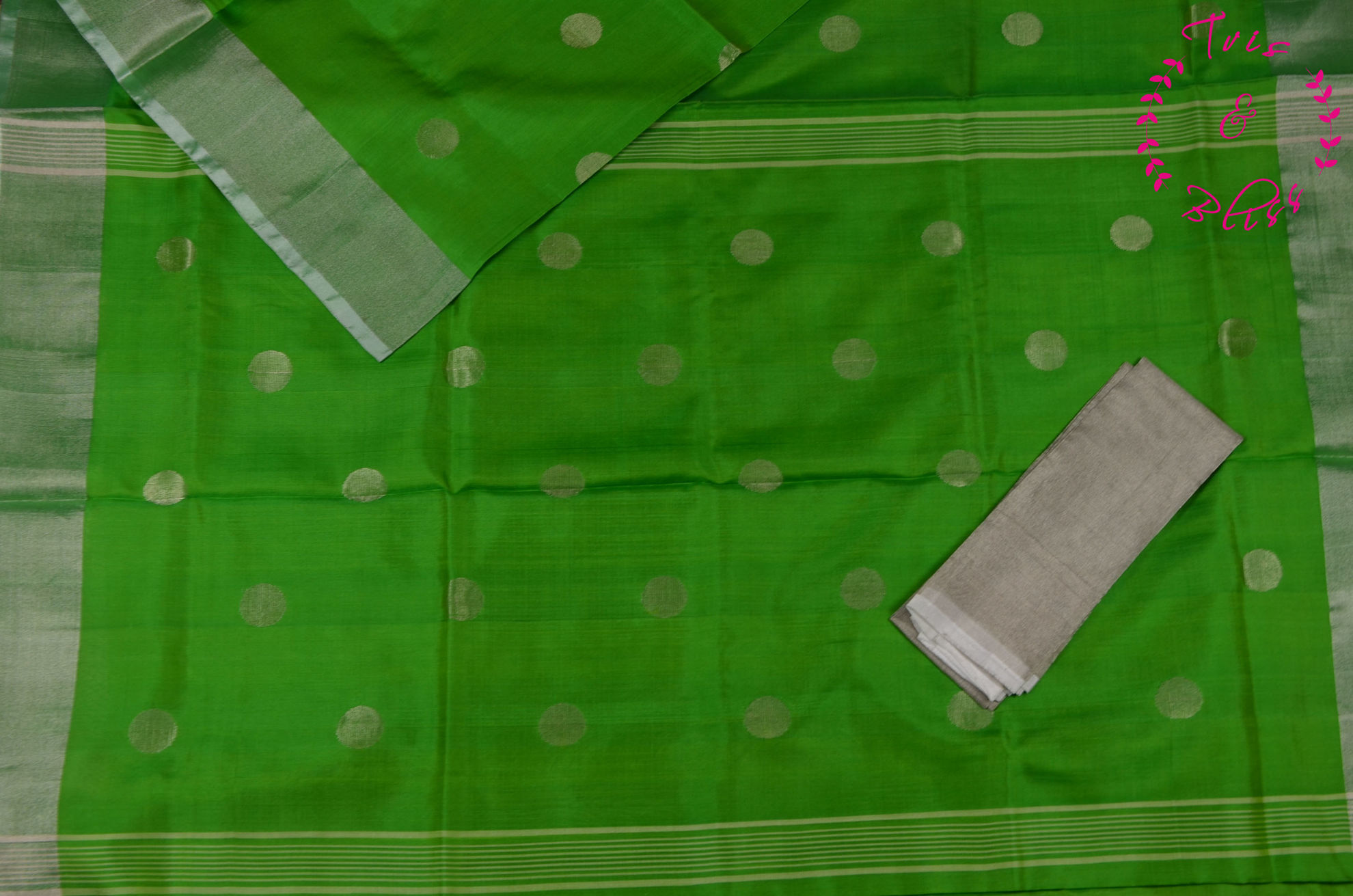 Tvis and Bliss. Parrot Green Uppada Silk Saree with Silver Butta and Border